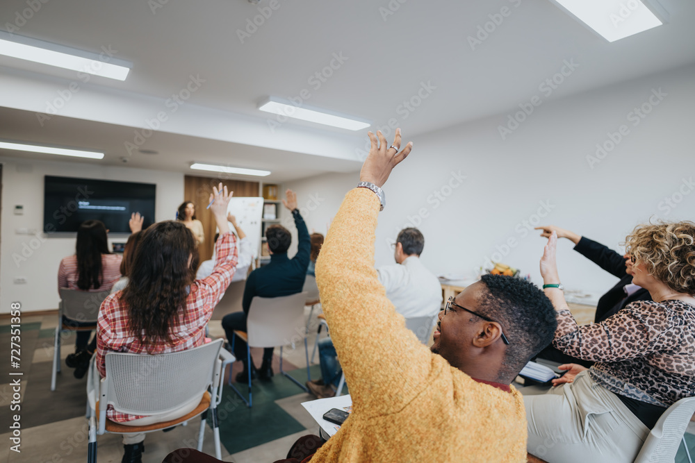 Diverse group of people actively participating in an educational ...