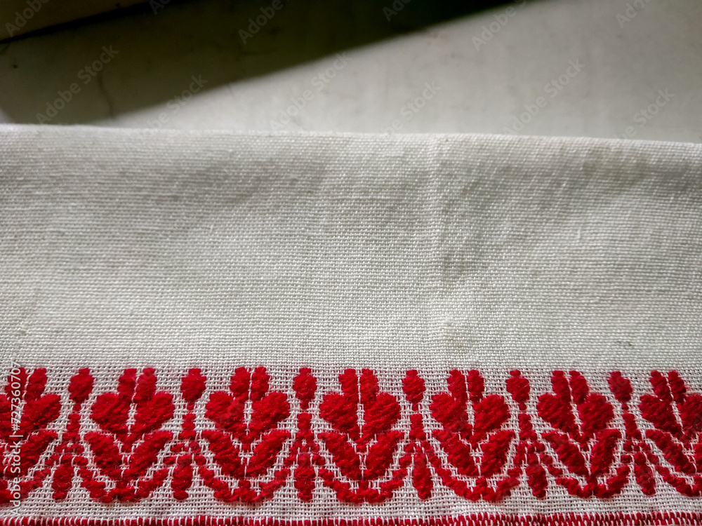 Gamosa or gamusa is a traditional textile pattern from Assam. It is a ...