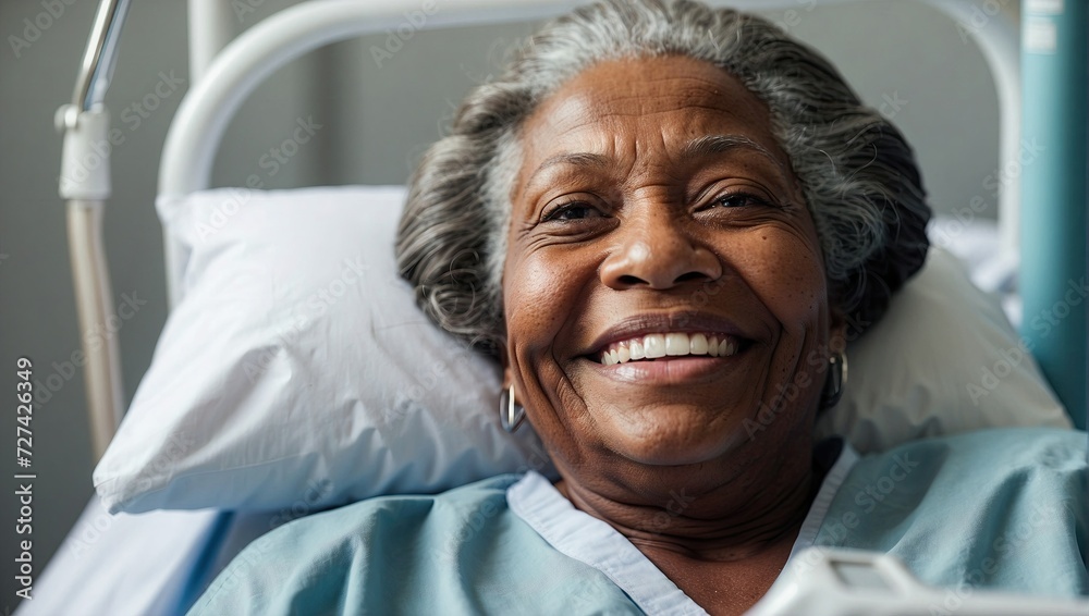 Elderly black woman smiling in hospital bed, close-up, gray hair ...