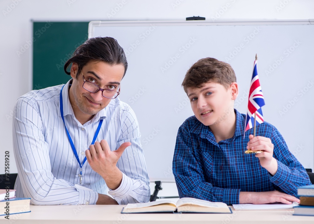 Male english teacher and boy in the classroom Stock Photo | Adobe Stock