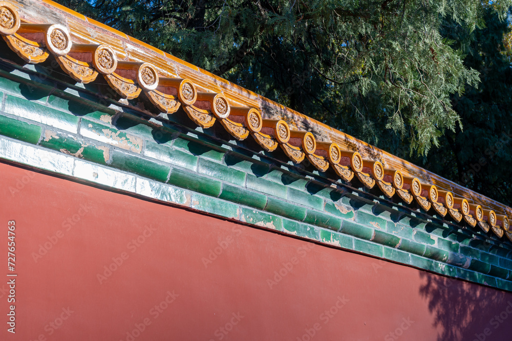 A side diagonal view of a traditional guarding wall of a palace complex ...