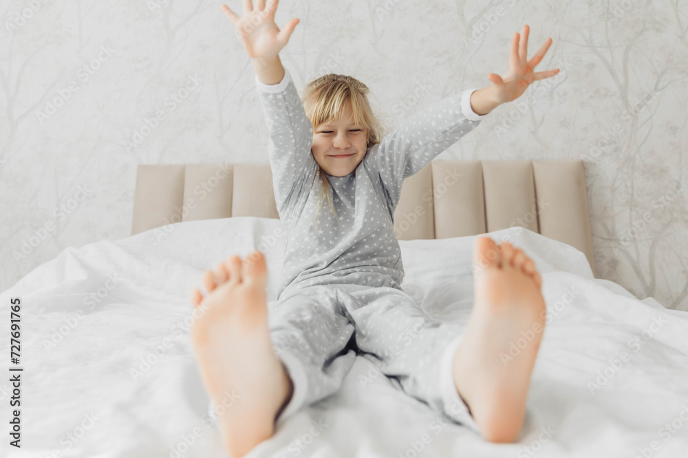 the bare, clean feet of two children, offspring, lying side by side ...