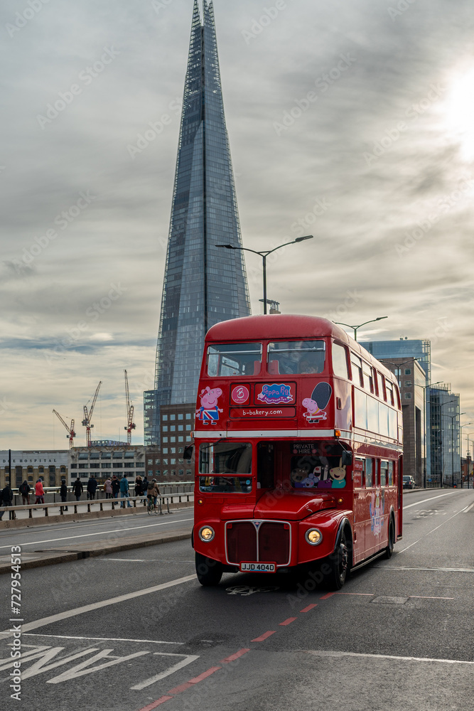Routemaster Bus crossing London Bridge with the Shard in the Background ...