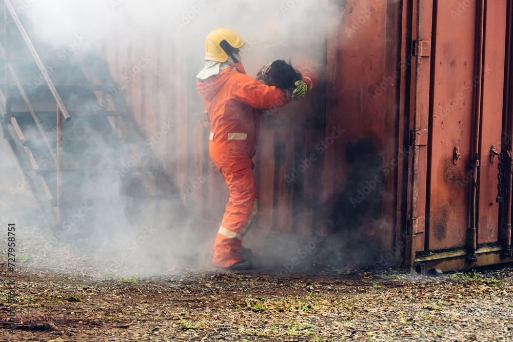 Foto de Firefighter to save girl in fire and smoke. Rescue Team or ...