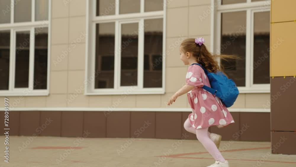 Happy little girl elementary pupil with backpack running to school ...