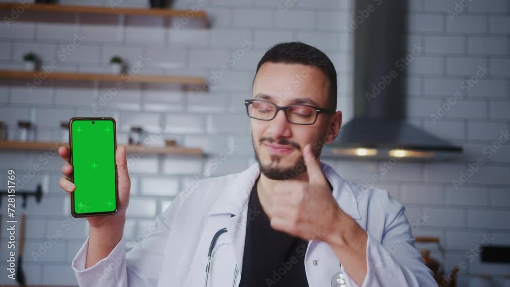 Male doctor with glasses wear uniform with stethoscope show app on the ...