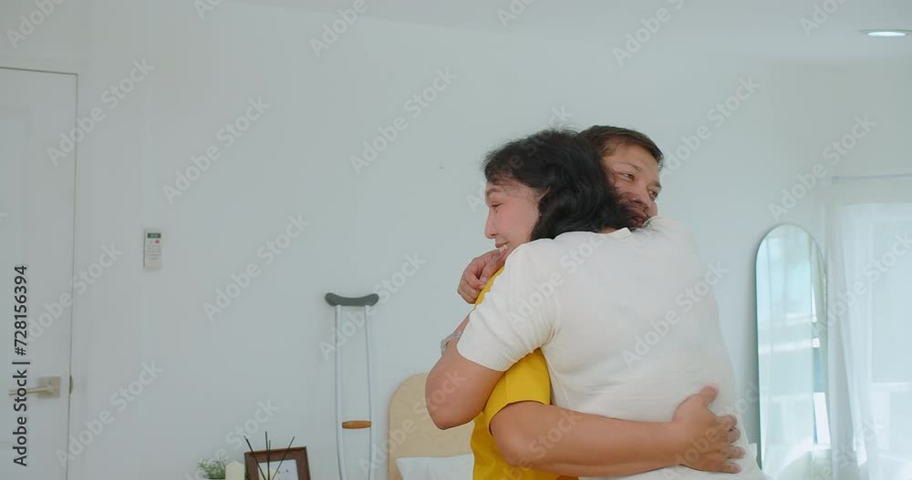 Embracing couple shares a heartfelt hug in a minimalist white room ...