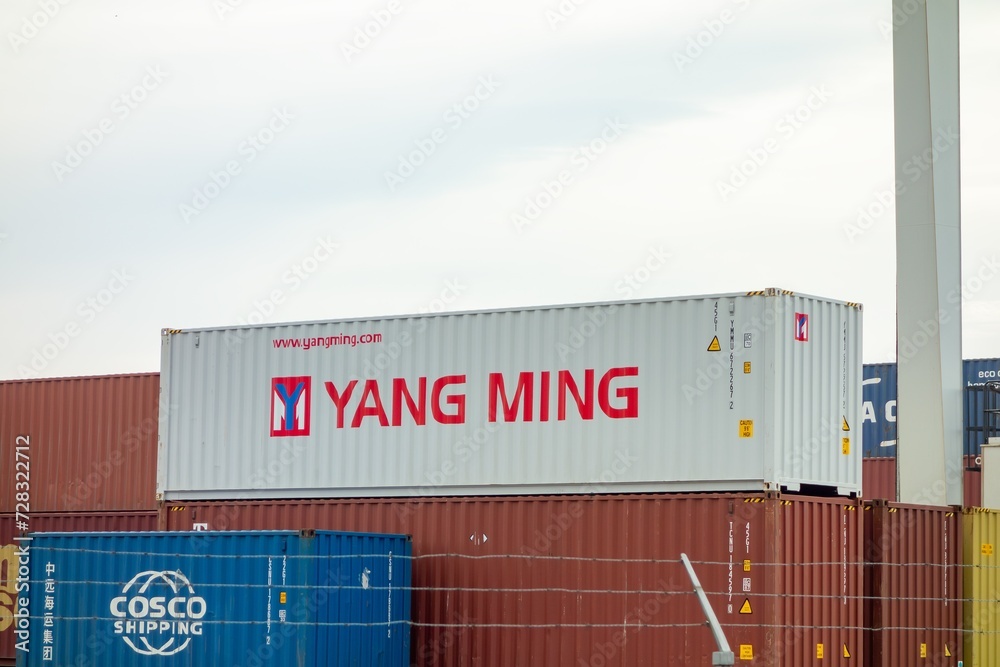 Yang Ming and Cosco Shipping containers at logistics centre Stock Photo ...