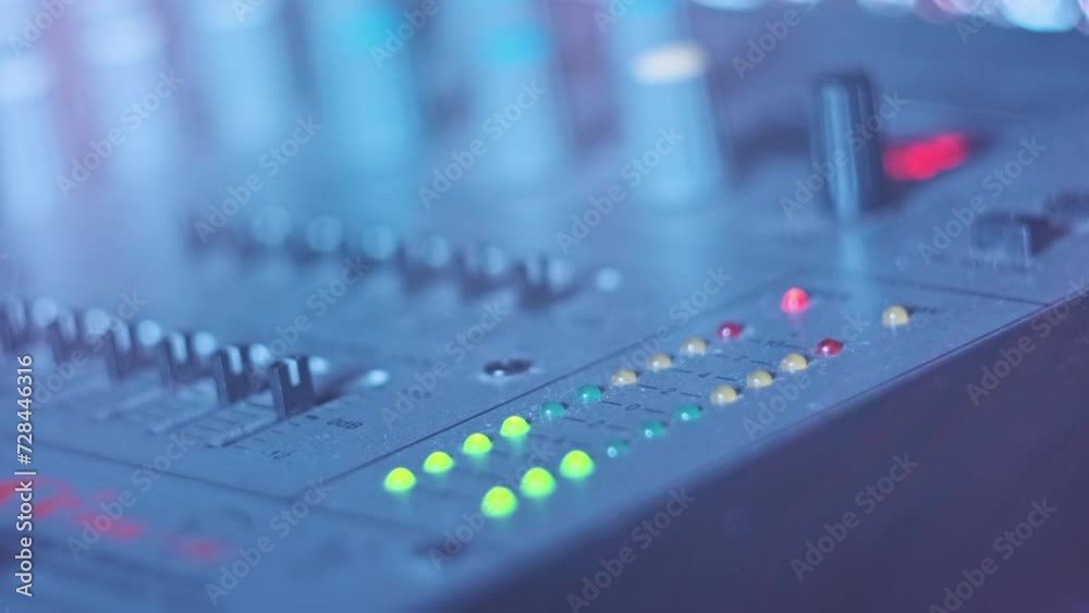 LED indicator of sound level signal on the mixing console in neon light ...