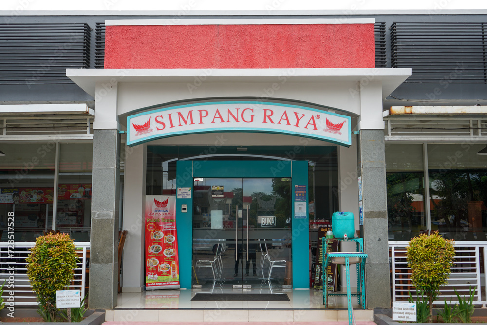 Simpang Raya Padang restaurant in front with a glass display case ...