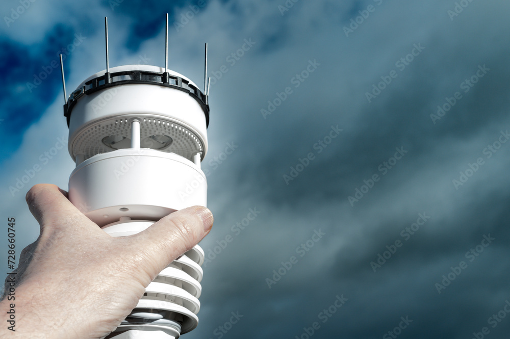 Meteorologist seen installing an advanced weather station which uses ...