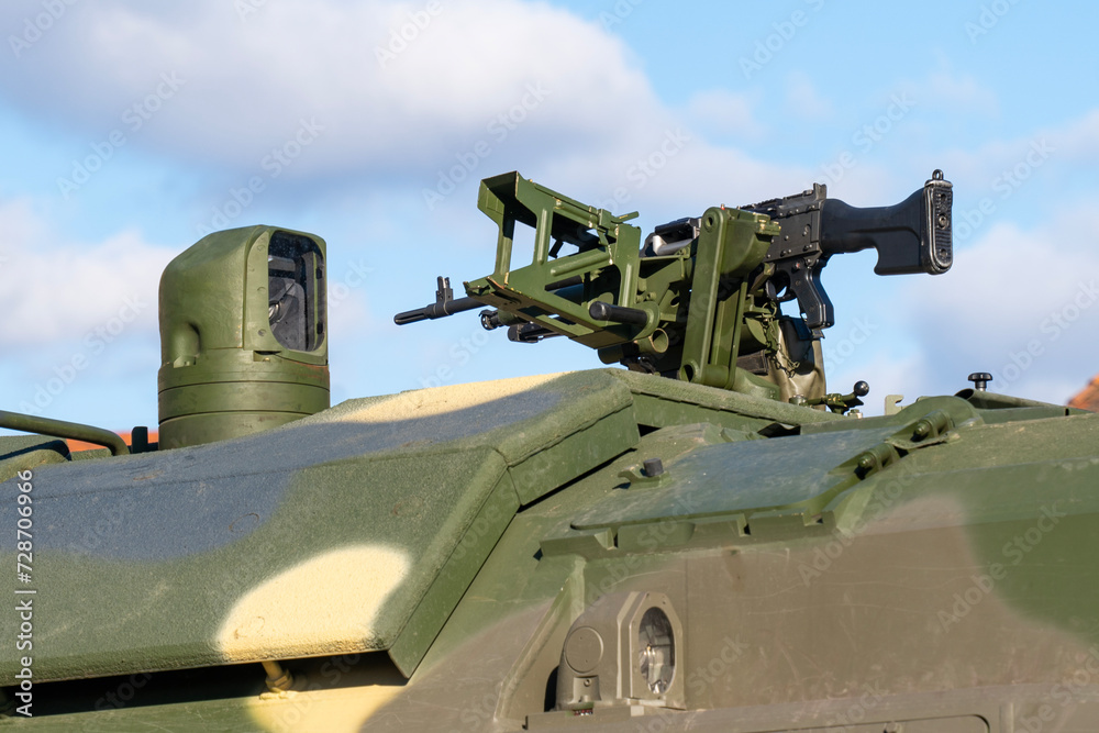 The turret machine gun of the modern camouflage armored self-propelled ...
