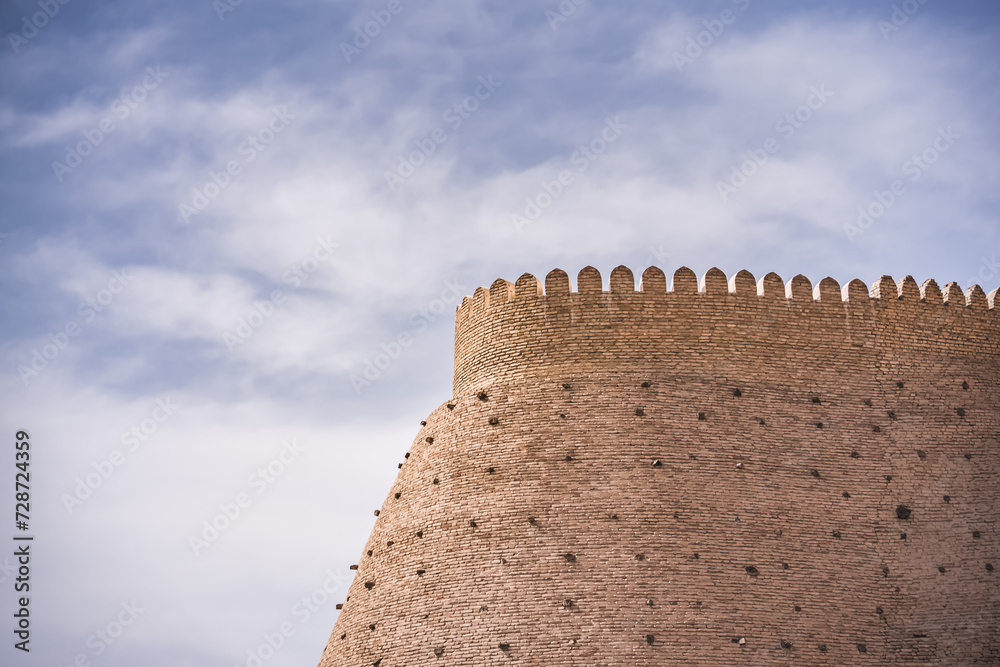 Ark Citadel with brick fortress walls in the ancient city of Bukhara in ...
