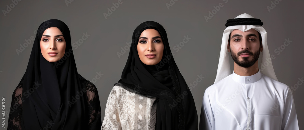 Portrait of three Emiratis in traditional attire, representing cultural ...