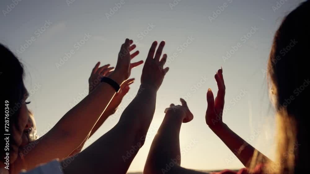 Group of people pulls their hands to sun sky. Teamwork religion and ...