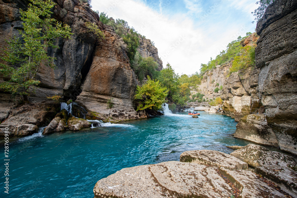 Transparent waters of Kopru River (Köprüçay, ancient Eurymedon) with ...