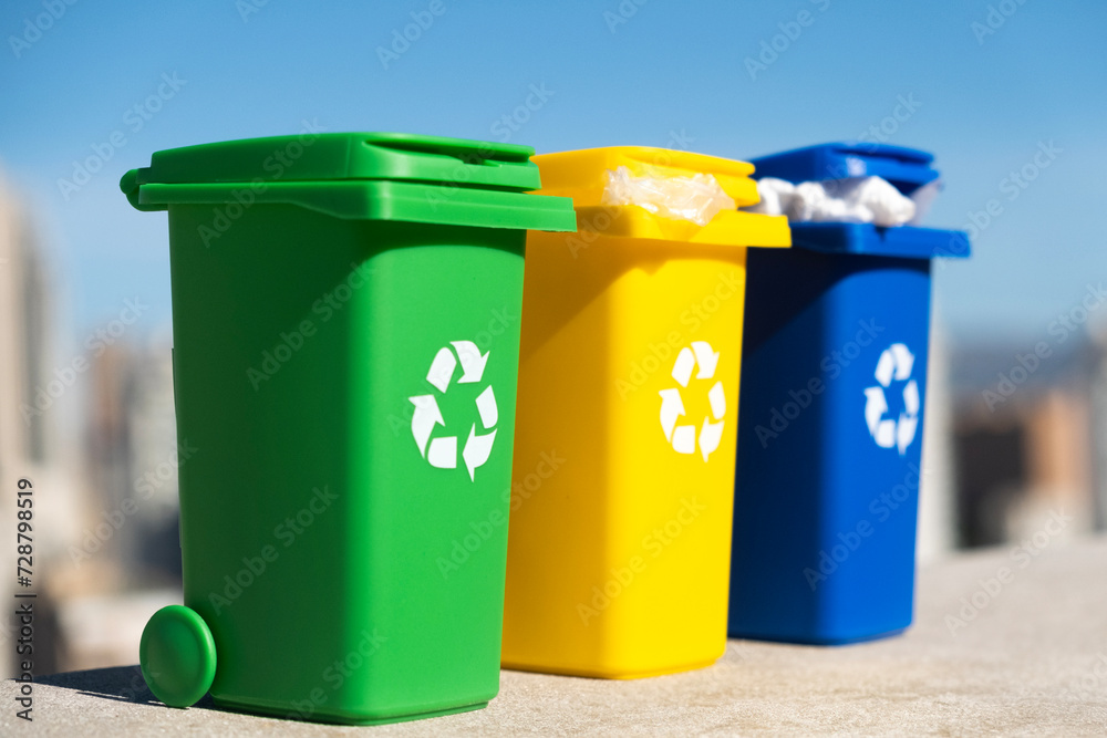 Container trash bin for recycling with city background. Yellow, green ...