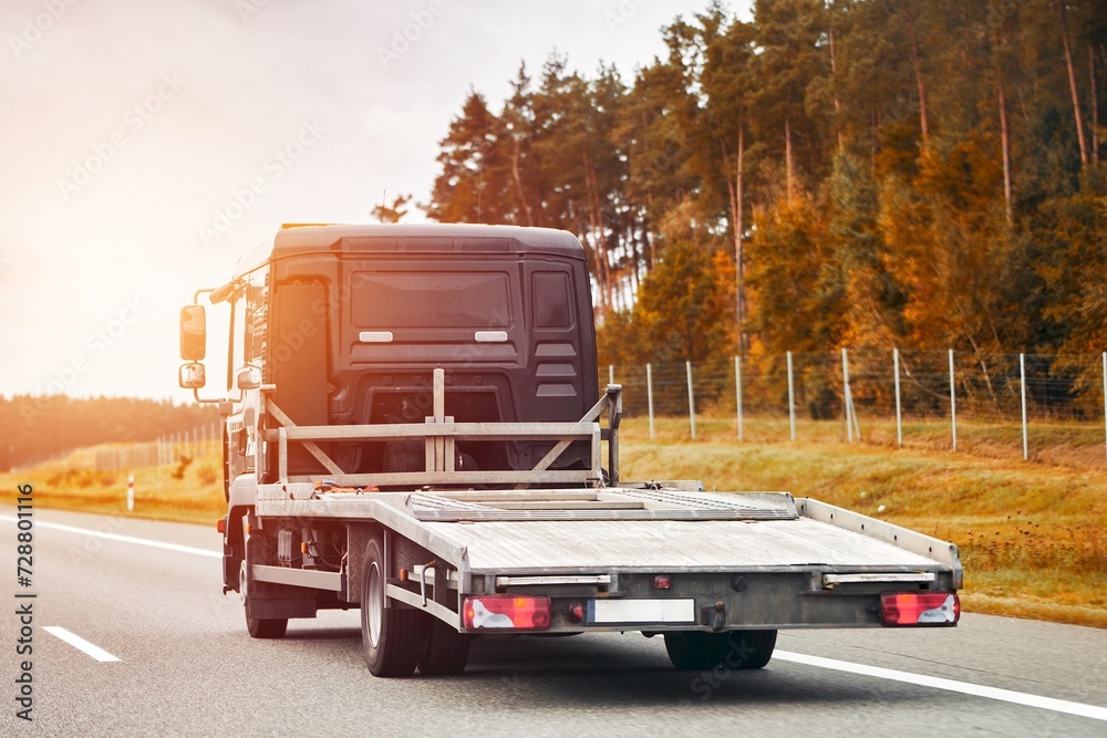 Roadside assistance transports a car with a breakdown on the road ...