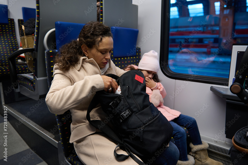 Authentic lifestyle portrait of diverse people travelling by high speed ...