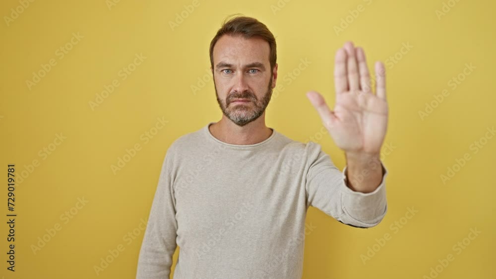 Vidéo Stock Serious hispanic man stares, hand up in stop gesture ...