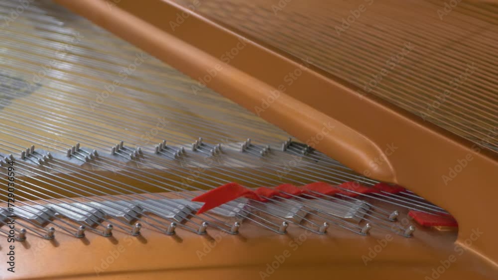 The taut strings inside old grand piano. Acoustic string instruments ...