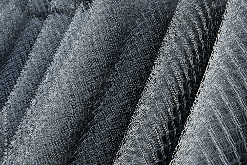 Coil of steel wire. Rabitz mesh netting roll as background ...