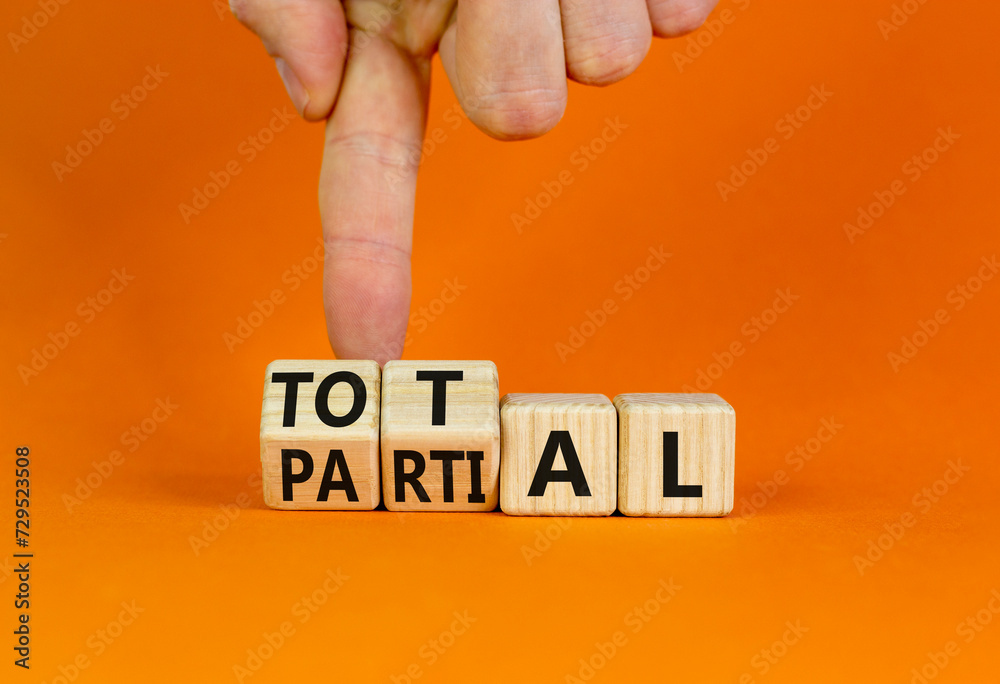 Total or partial symbol. Businessman turns beautiful wooden cubes and ...