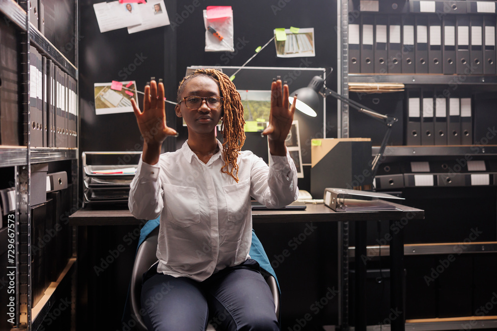 African american woman police detective using ar to visualize crime ...