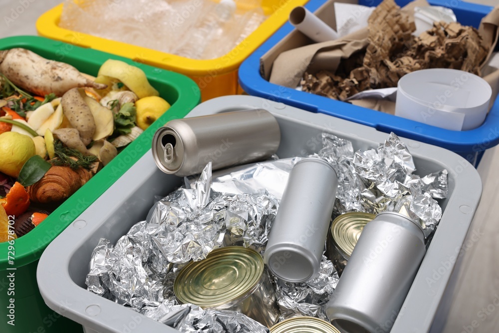 Garbage sorting. Full trash bins for separate waste collection indoors ...