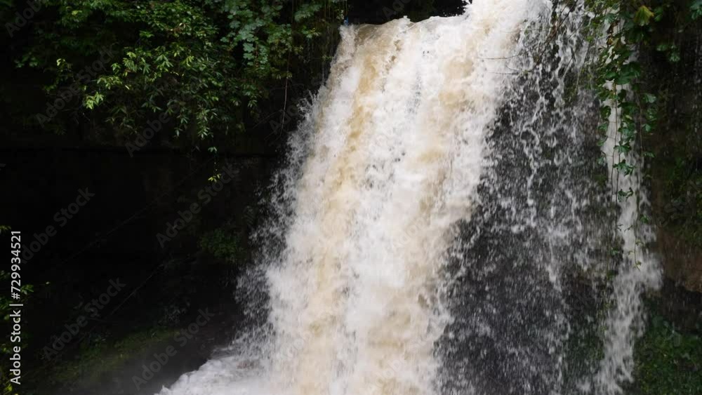 Waterfall in rainy season. Fast flowing waterfall river between canyon ...