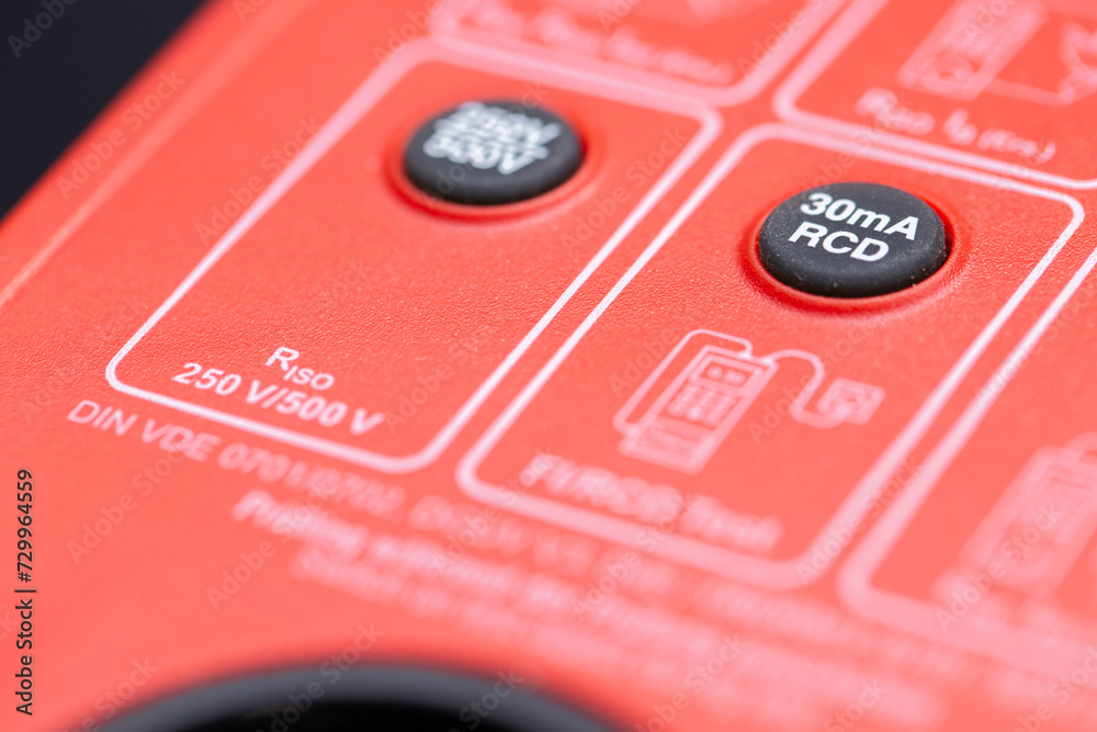 close-up of buttons from tester device to measure and prove the safety ...