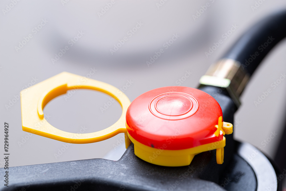 closeup of a palm button of a reusable and refillable foam fire ...