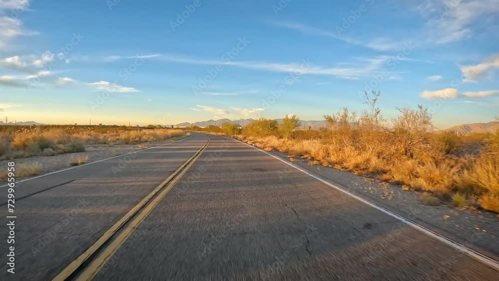 POV - Driving on a asphalt road with some traffic through Sonoran ...