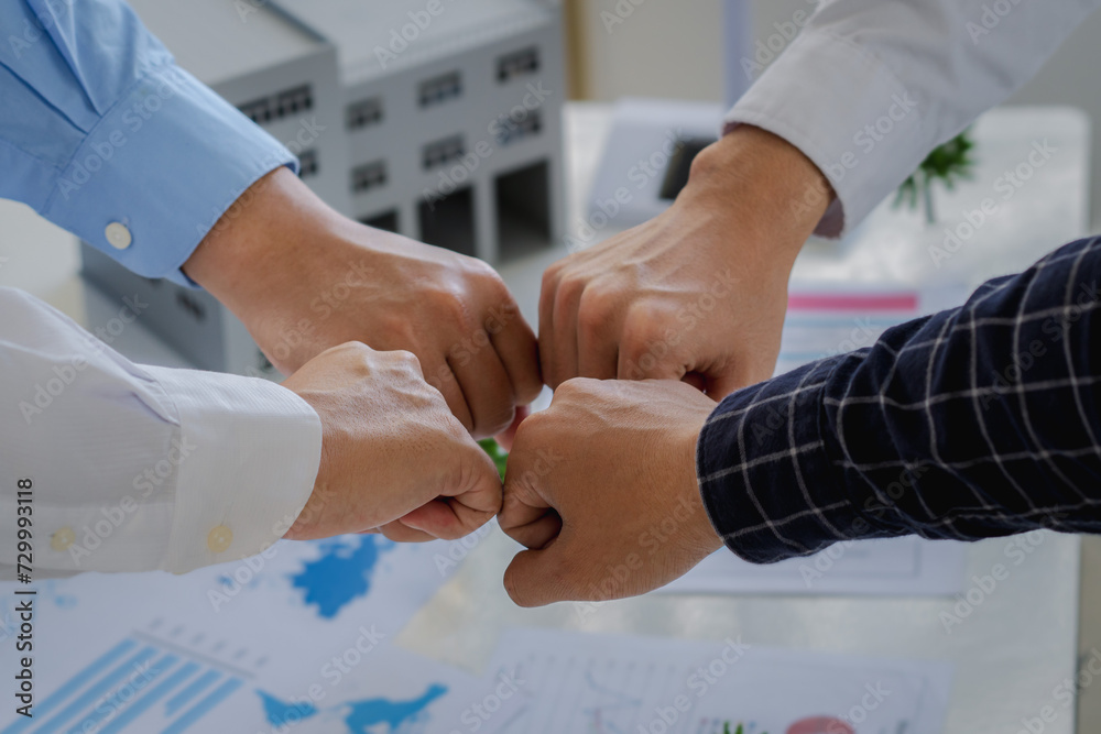 Team of engineer and architects working join hands to build successful ...