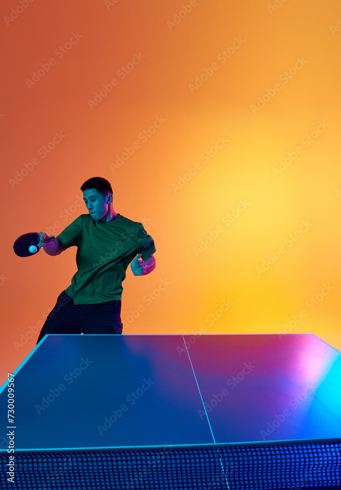 Asian athlete man, ping pong player training hitting ball in action in ...
