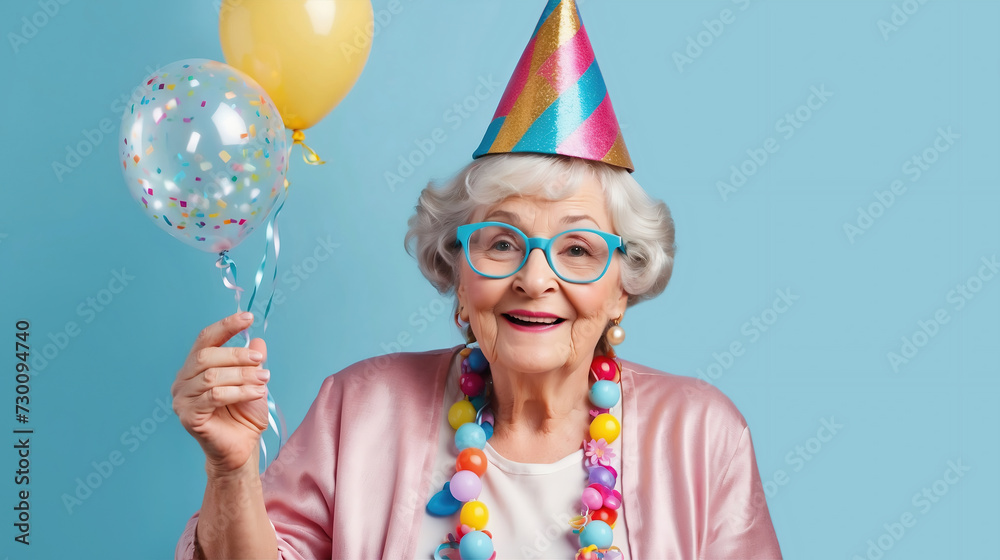 Cheerful grandmother with balloons celebrating birthday party. Happy ...