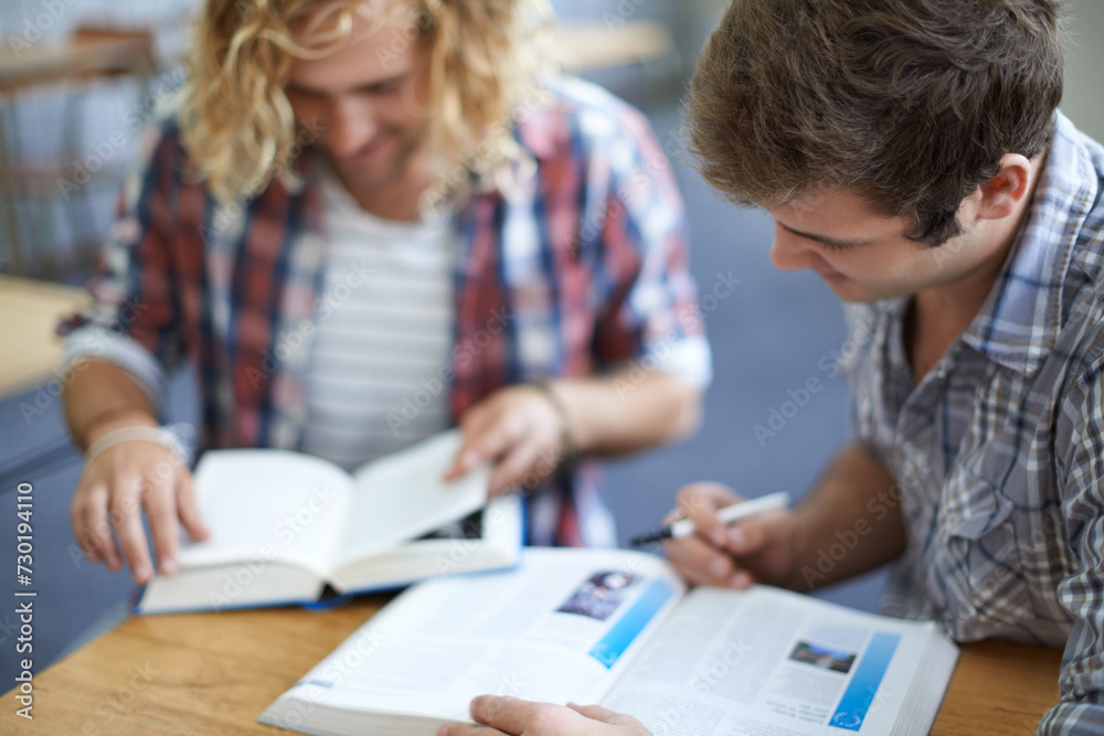 Men, students and reading from textbook in university classroom for ...