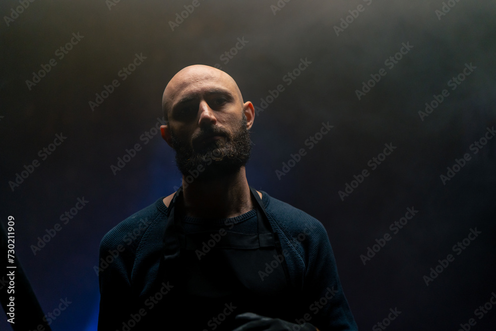 bald brazen robber with beard holding baseball bat during robbery ...