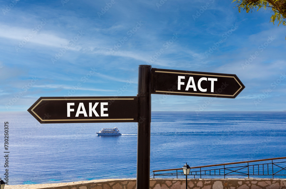 Fact or fake symbol. Concept word Fake and Fact on beautiful signpost ...