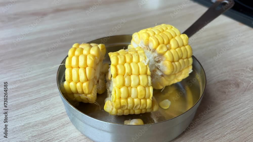 Vidéo Stock Sweet Yellow Corn Fresh Boiled and Hot on a Plate on Lunch ...