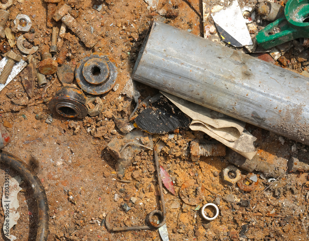 rusty and pieces of iron at the bottom of the container of a recycling ...