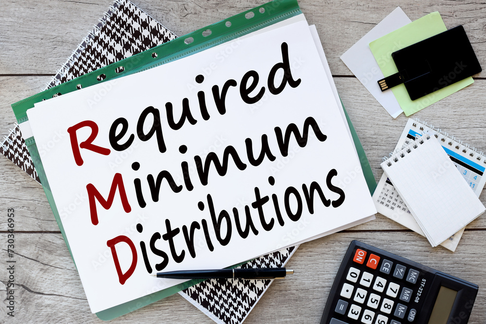 Required Minimum Distributions (RMD). text on page on green folder ...
