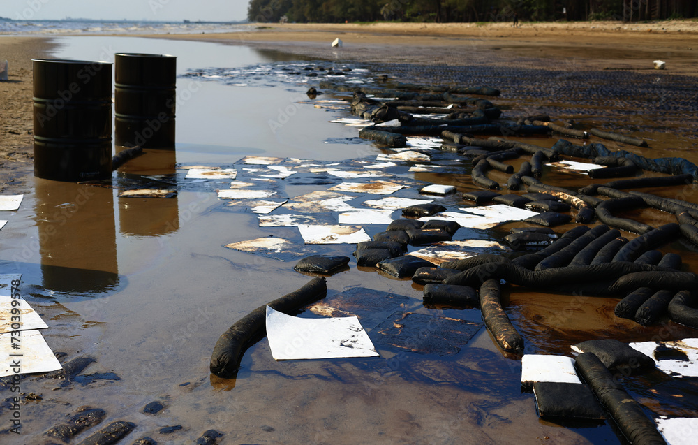 A crude oil spill on the sand of a city beach Beach oil spill impacts ...