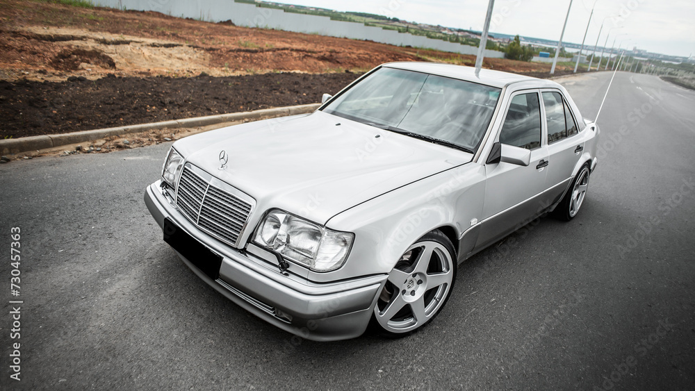 car on the road Mercedes-Benz E500 W124 Silver rear detail logo front ...