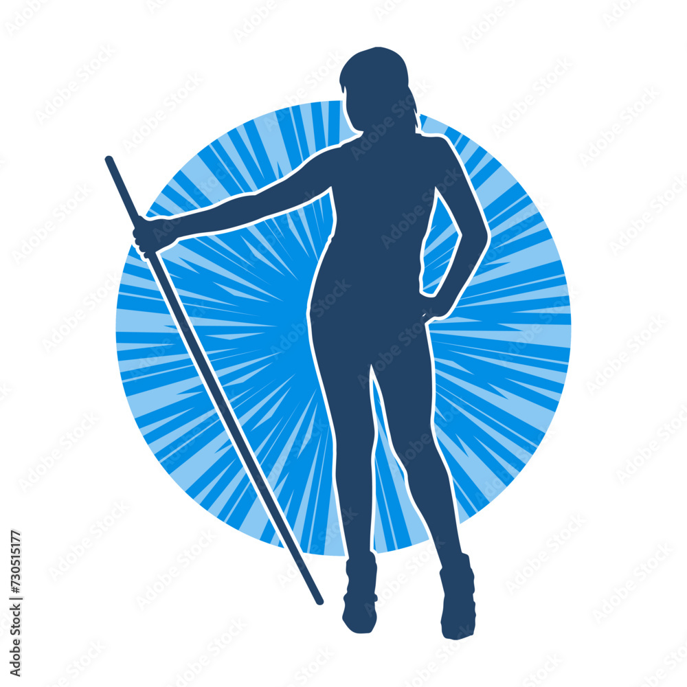 Silhouette of a slim female fighter in standing pose with her staff ...