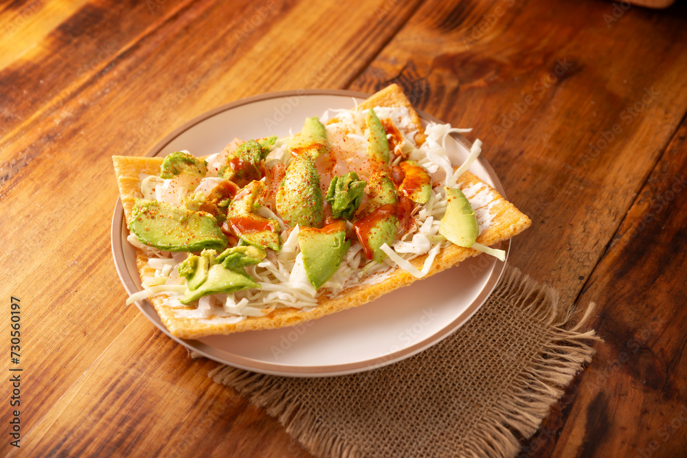 Fried wheat flour toast with pickled pork skin, sour cream and ...