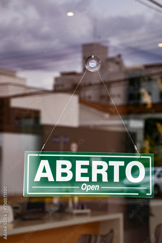 Bilingual sign with the words Aberto and Open in Portuguese and English ...