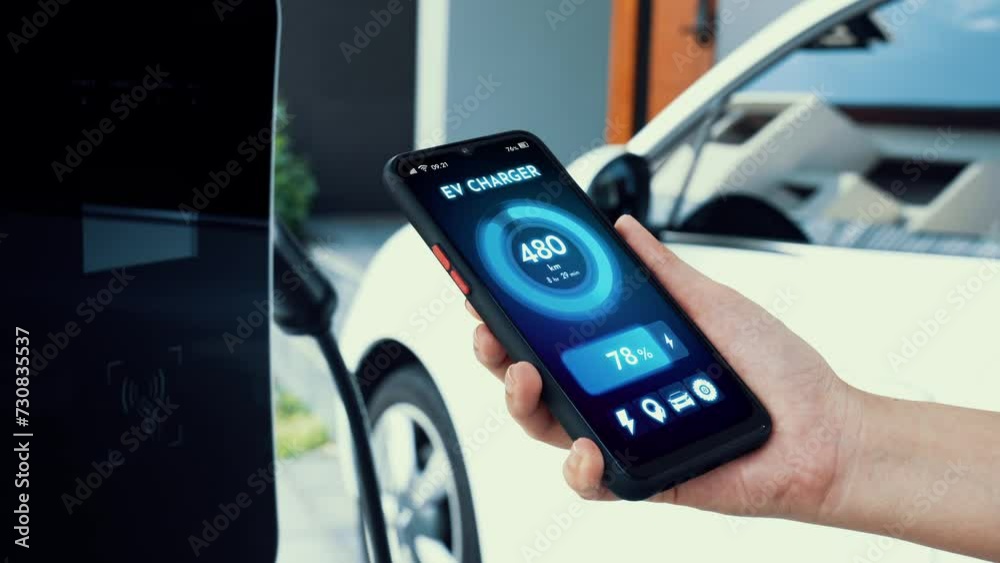 Smartphone display battery status on smart EV mobile application while ...