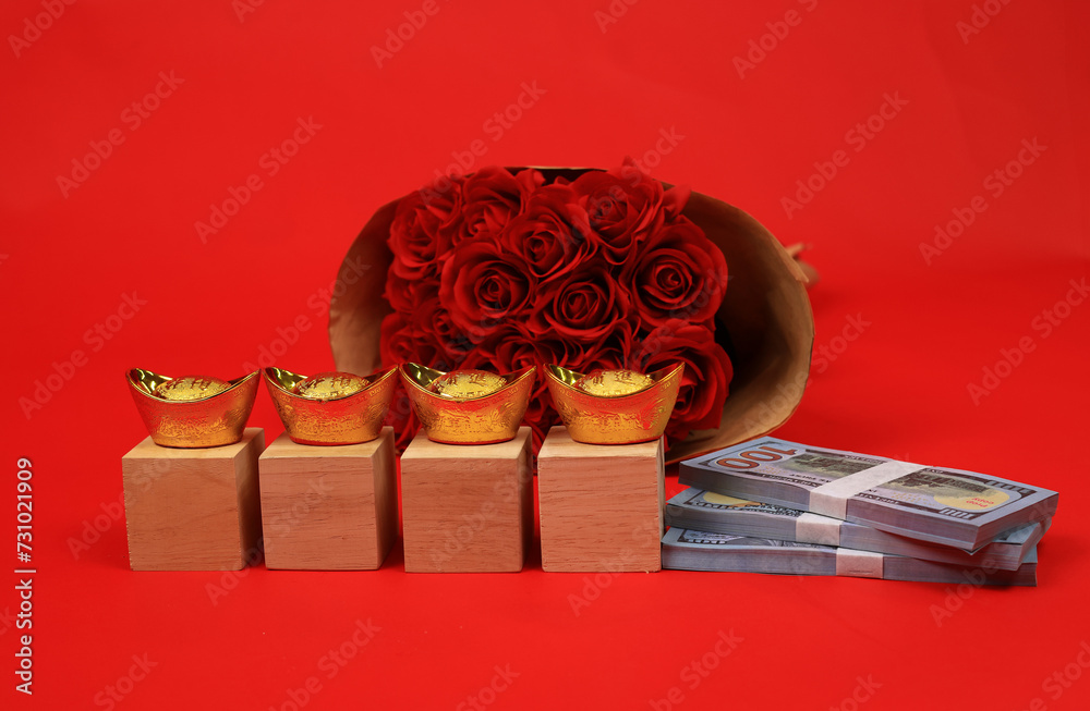Model of Cash US dollars and a bunch of red roses with a blank cube ...