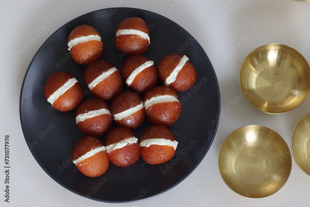 Malai Gulab Jamun. Gulab Jamun sandwich with milk cream filling. Fusion ...